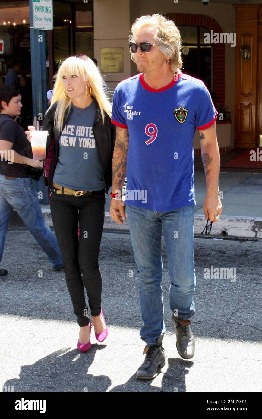 Former Guns N' Roses and Velvet Revolver drummer Matt Sorum holds hands ...