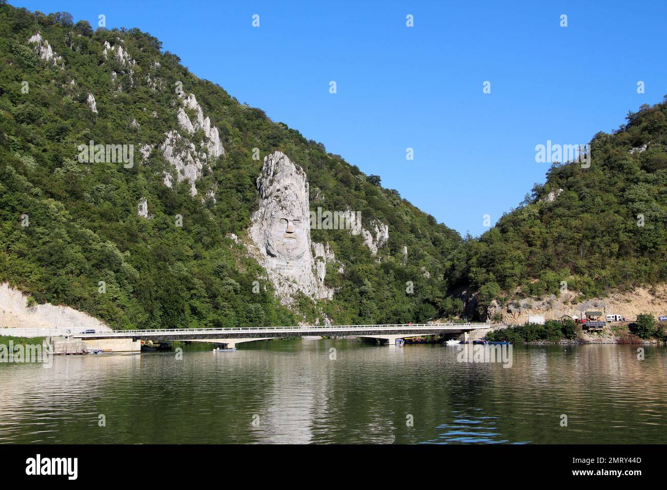 Decebal's head sculpture on the blue Danube in Romania Stock Photo - Alamy