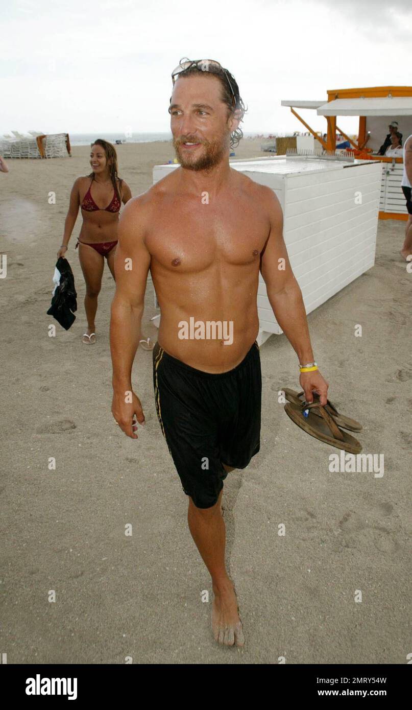 Hunky actor Matthew McConaughey goes for a dip in the ocean during a ...