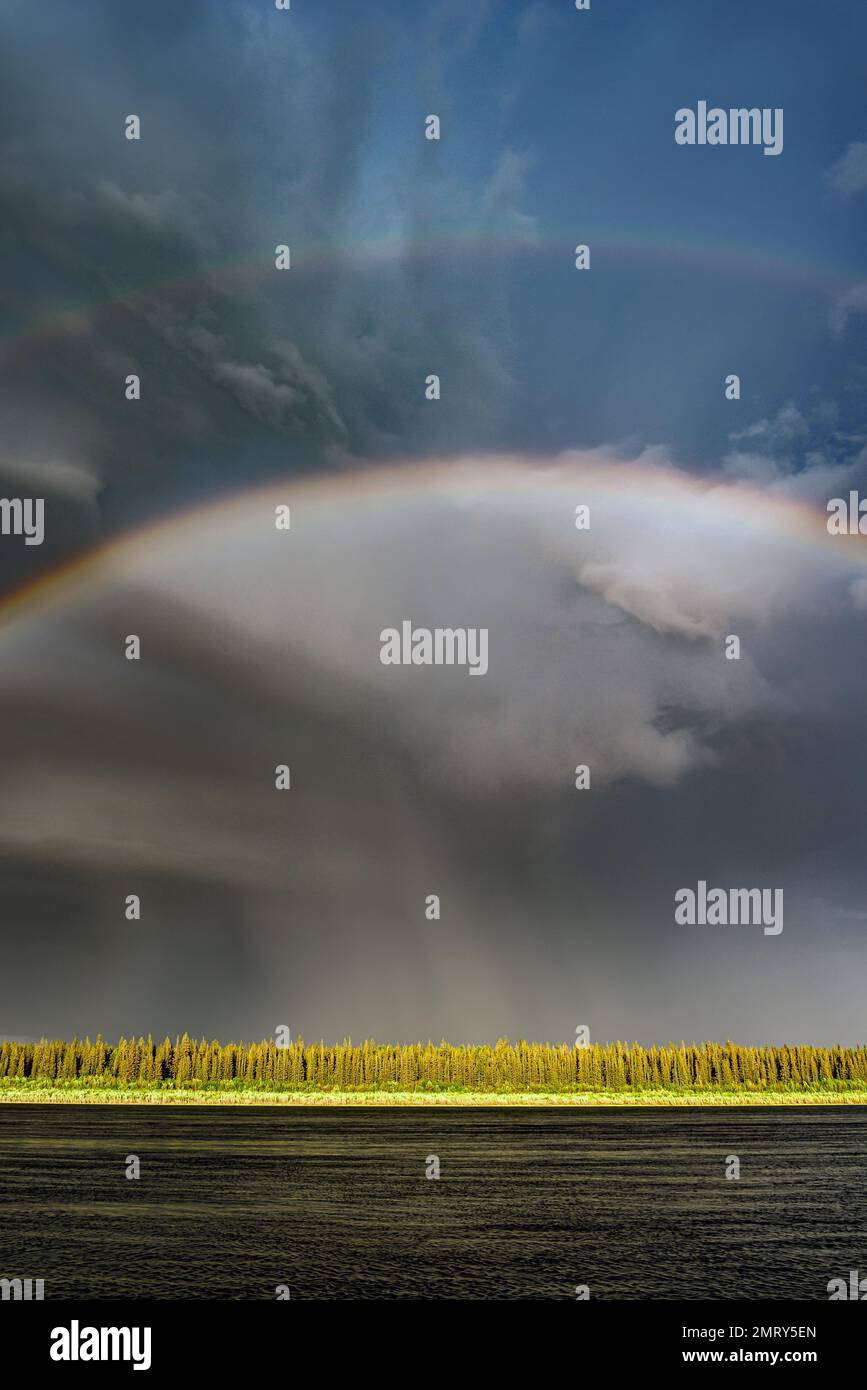 A double rainbow over the Vilyui River after rain against a sky with ...