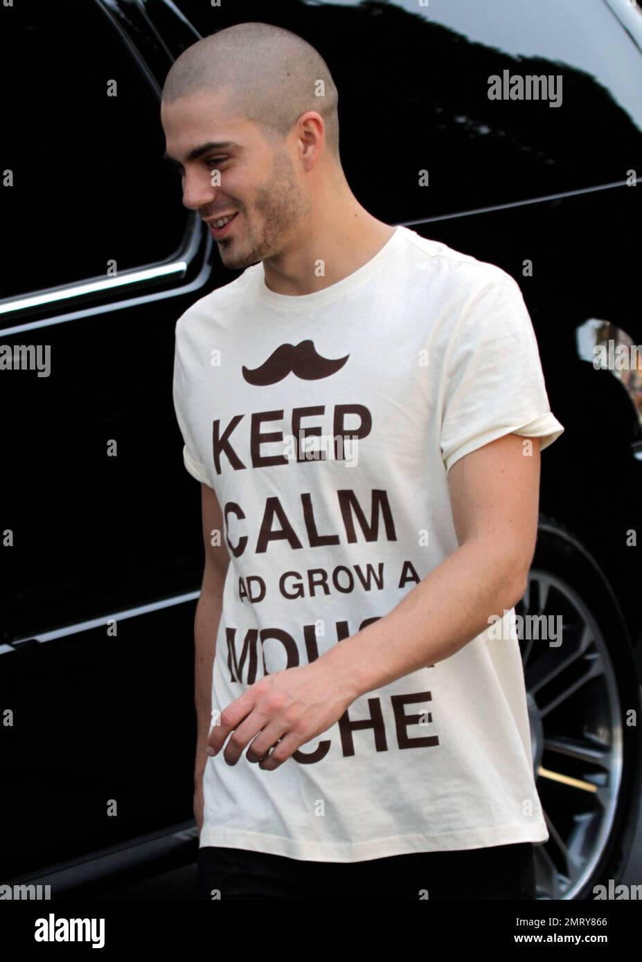 Wearing a "Keep Calm and Grow a Moustache" t shirt, Max George of the ...