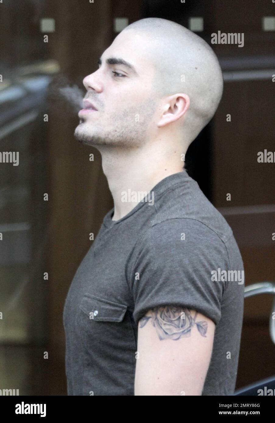 Max George of the UK boy band The Wanted shows off his tattoos while ...