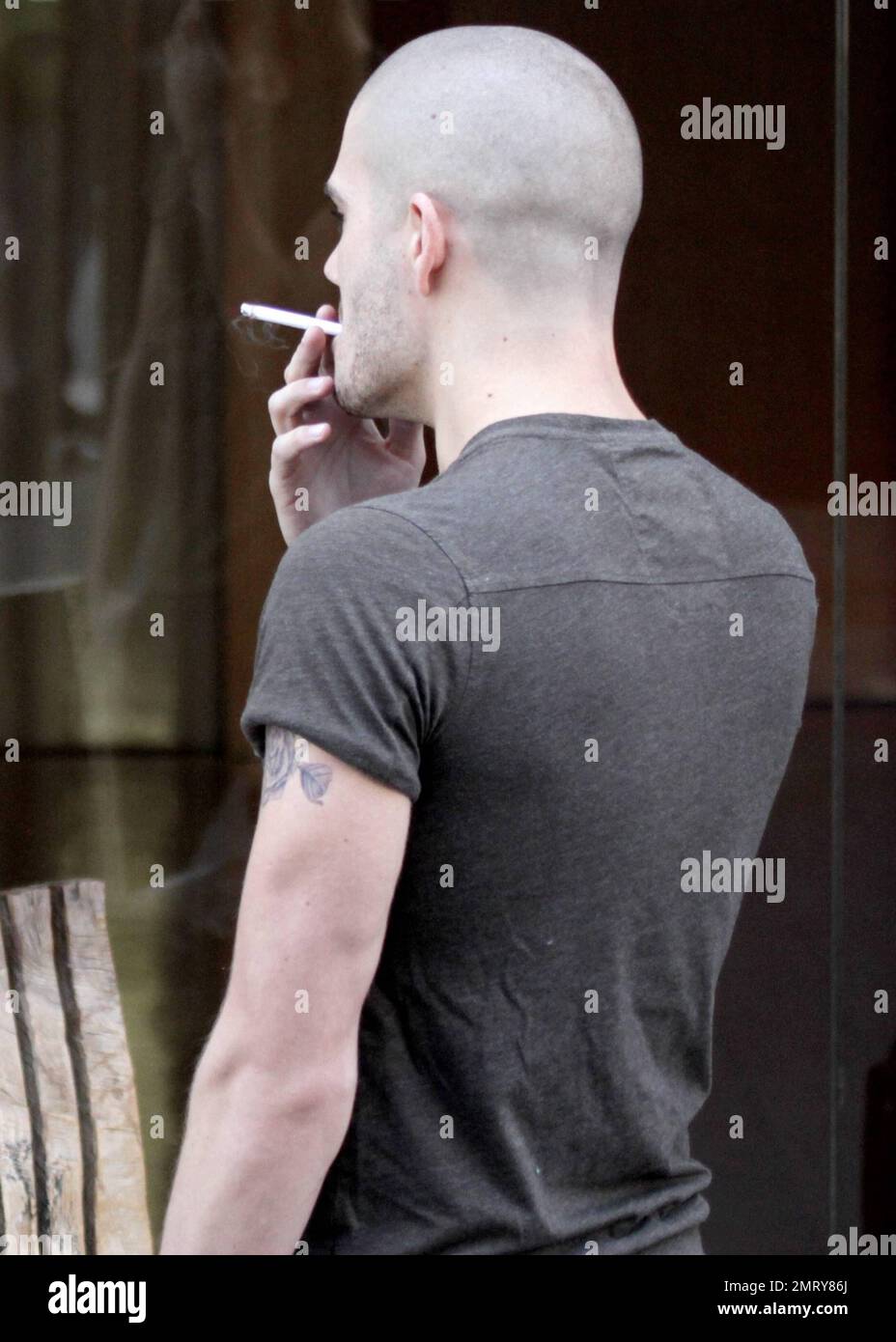 Max George of the UK boy band The Wanted shows off his tattoos while ...