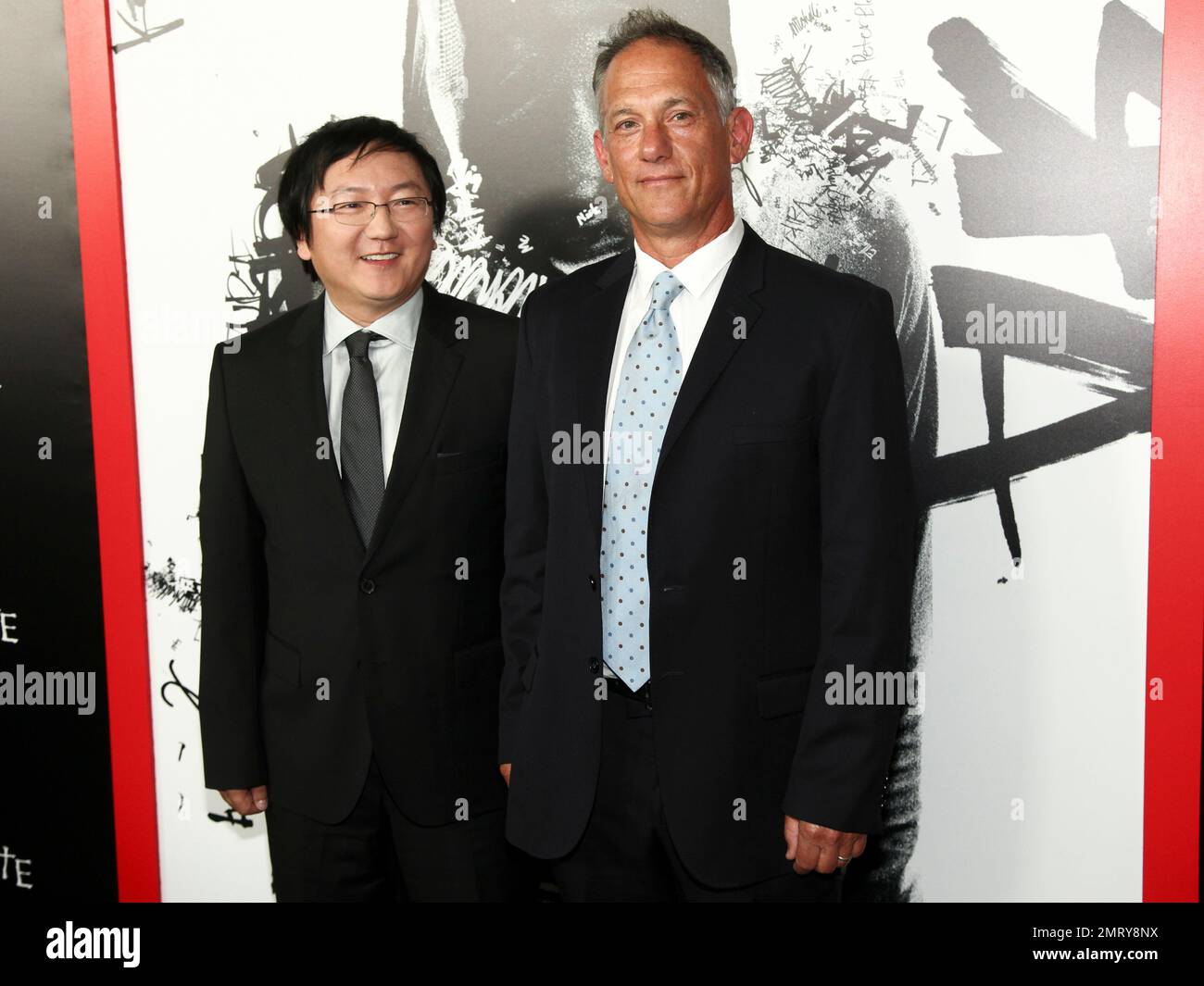Masi Oka, left, and Jason Hoffs, right, attend the premiere of Netflix ...