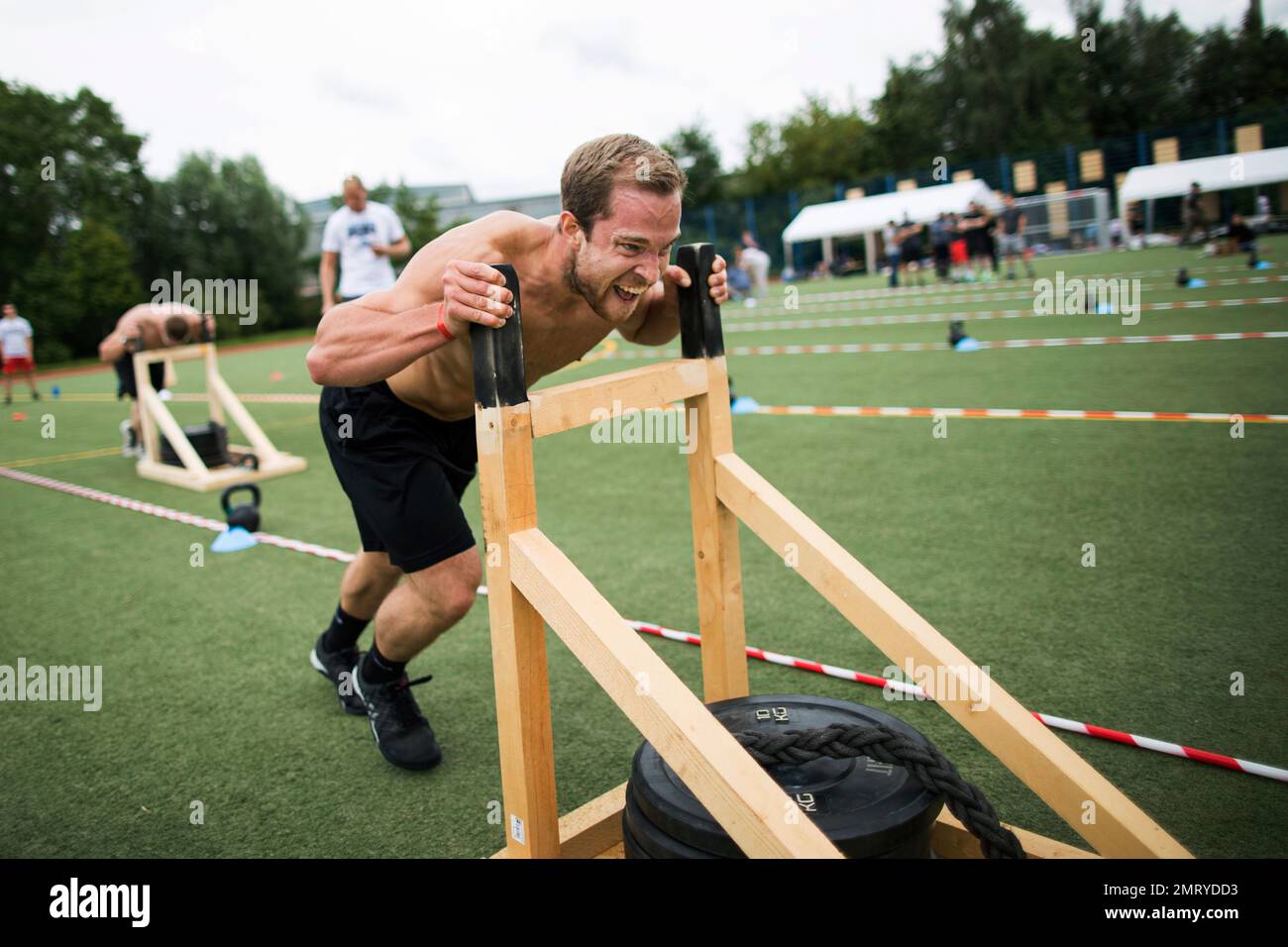 In this Aug. 5, 2017 photo Pit Ressler of Kiel's Foerde CrossFit pushes ...