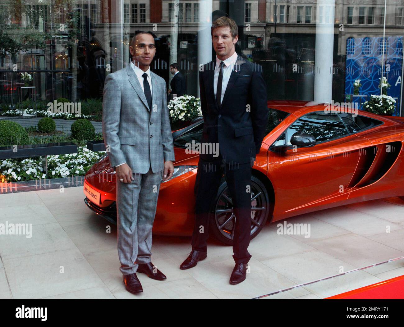 Jenson Button and Lewis Hamilton at the McLaren Automotive Showroom ...