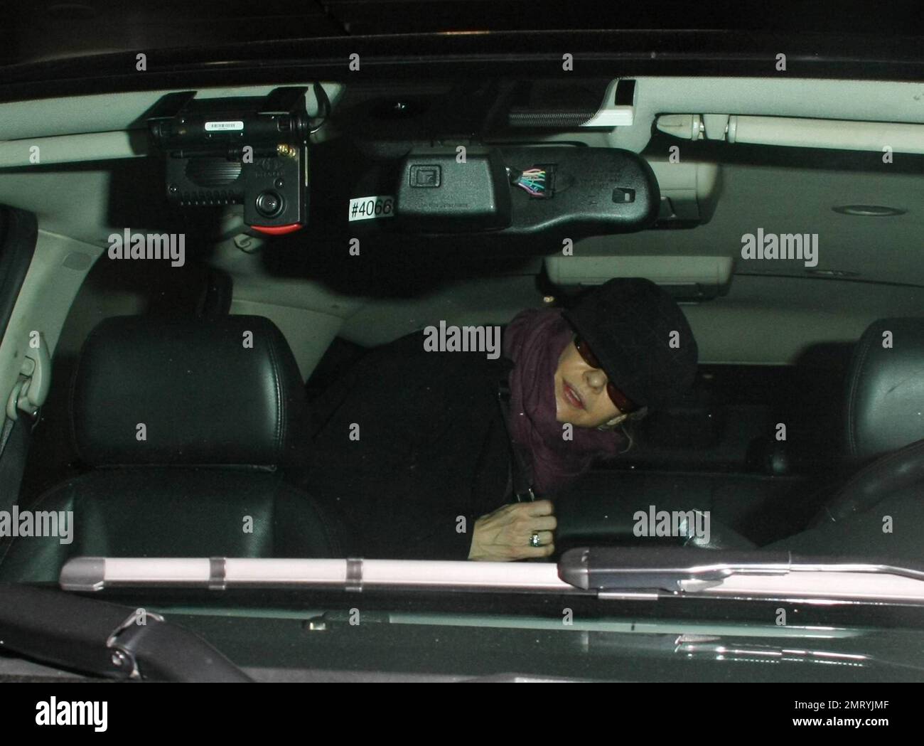 EXCLUSIVE!! A make-up free Meg Ryan is camera shy as she arrives at LAX ...