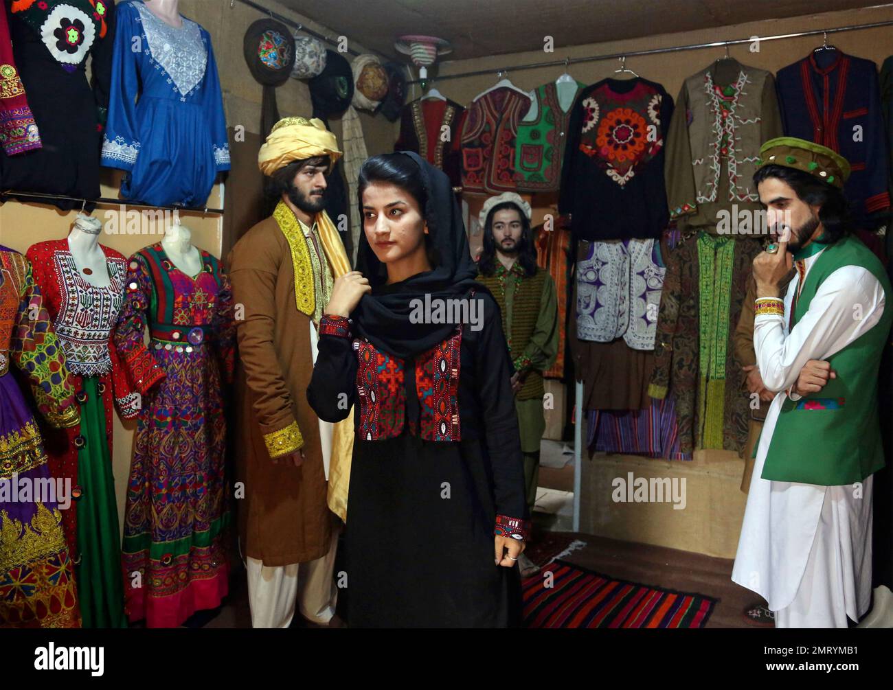 In this Thursday, Aug. 3, 2017 photo, Mahal Wak, center, a model for ...