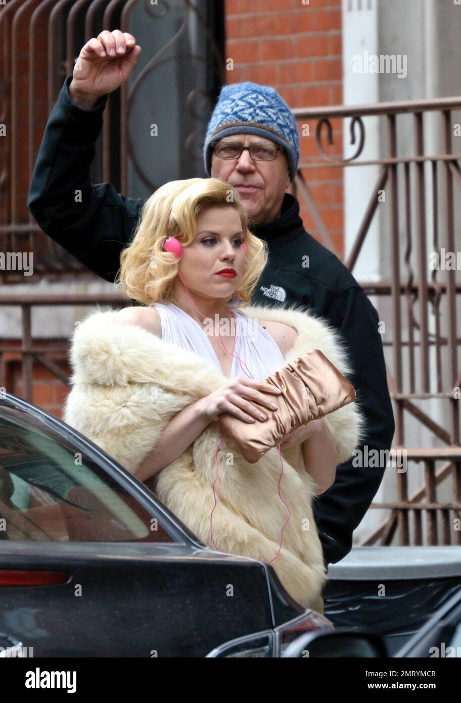 Dressed as Marilyn Monroe and wearing pink headphones, actress Megan ...