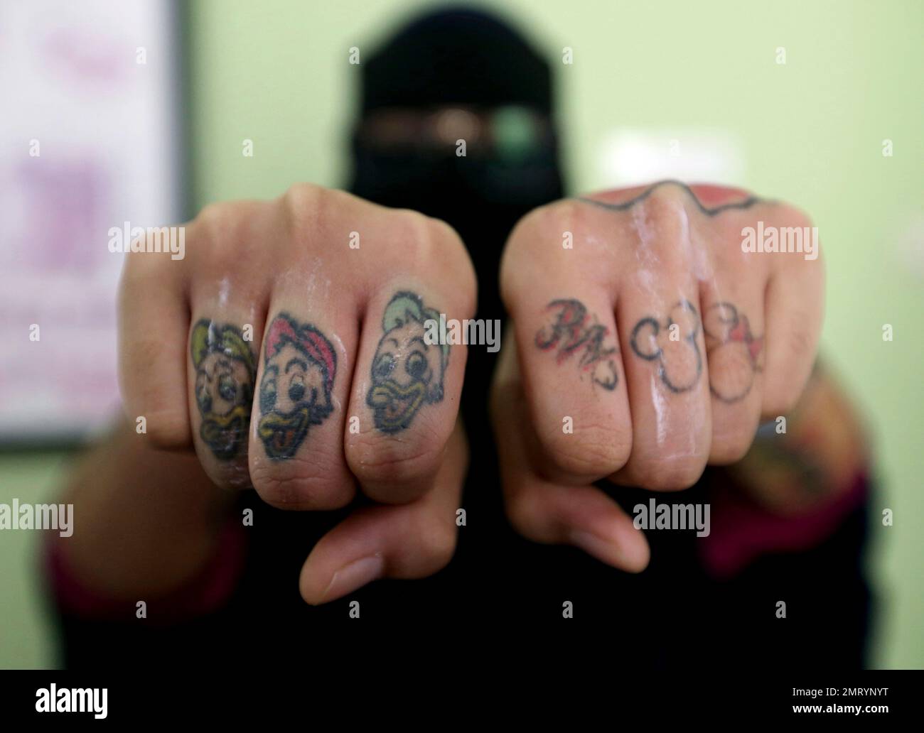 In this Aug. 11, 2017 photo, 19-year-old former tattooist Sri Novianti ...