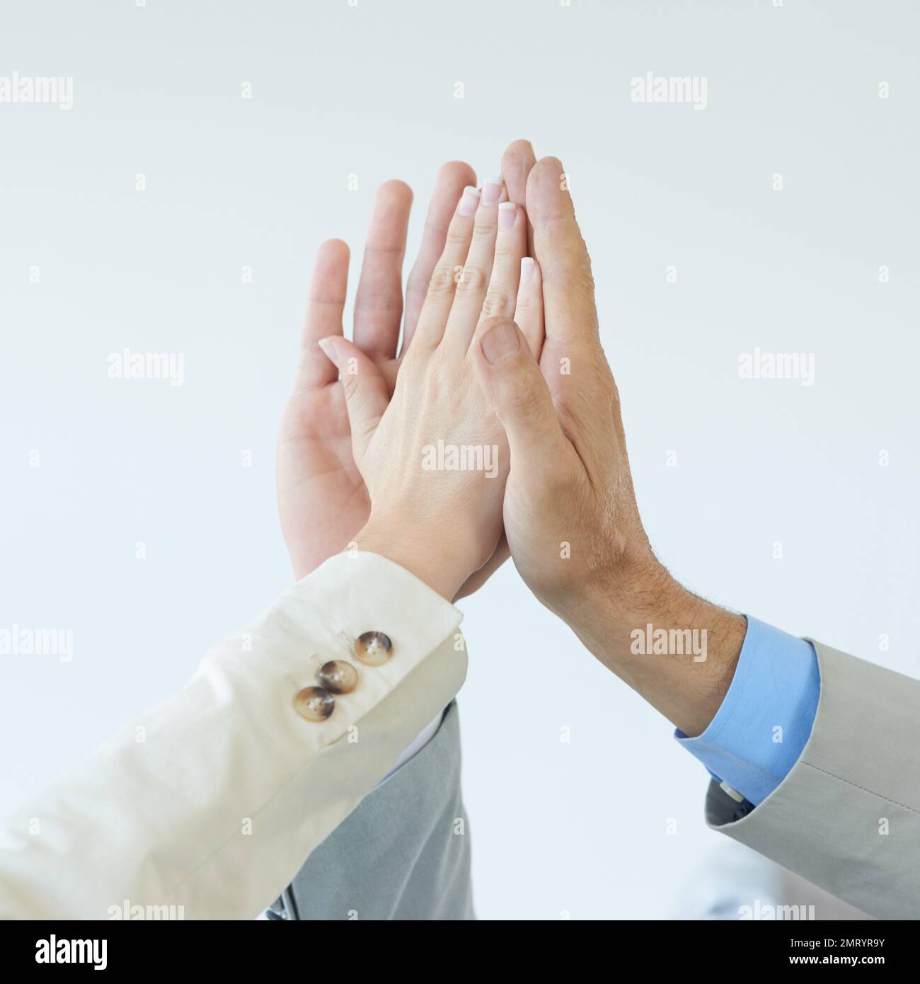 Go team. Business people celebrating another success deal with a high ...