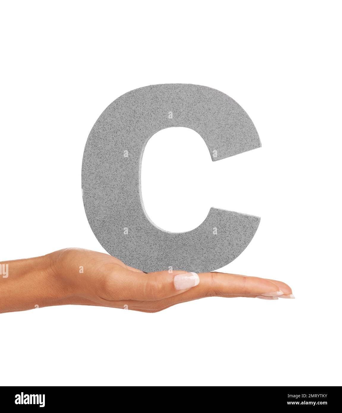 Learning letter C. A young woman holding a capital letter C isolated on ...