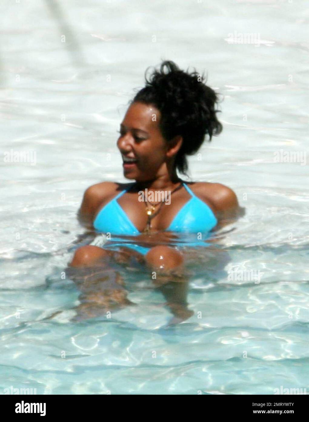 Mel B hits the pool at her luxury hotel with boyfriend Stephen Belafonte and pals. The pair swam ...