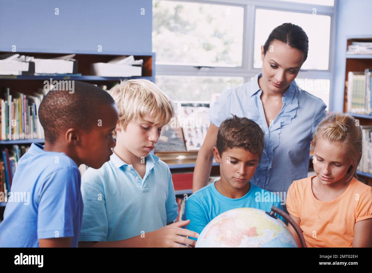 Getting to grips with geography. A pretty young geography teacher ...
