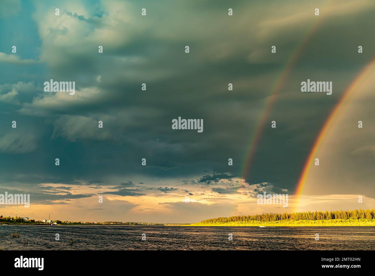 A double rainbow after rain during the day over the Vilyui River ...