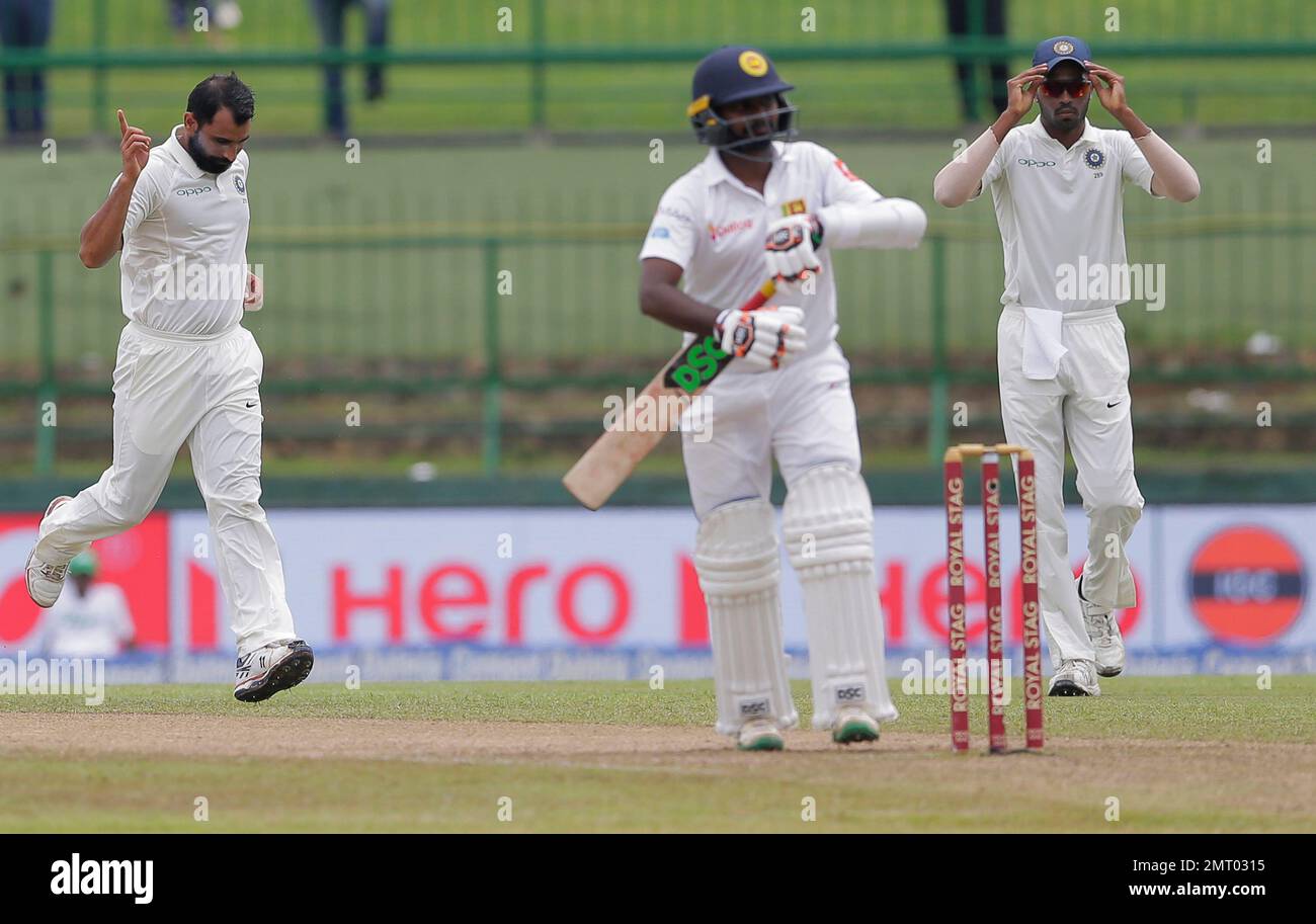 India's Mohammed Shami, left, celebrates the dismissal of Sri Lanka's ...