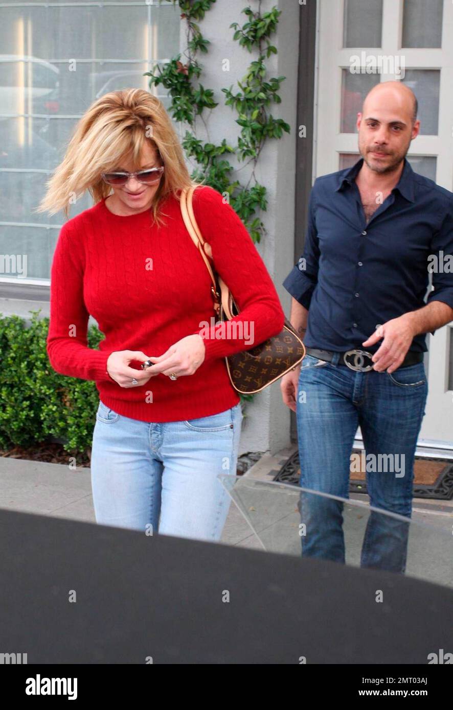 Actress Melanie Griffith is all smiles as she leaves the Neil George Salon in Beverly Hills, CA ...