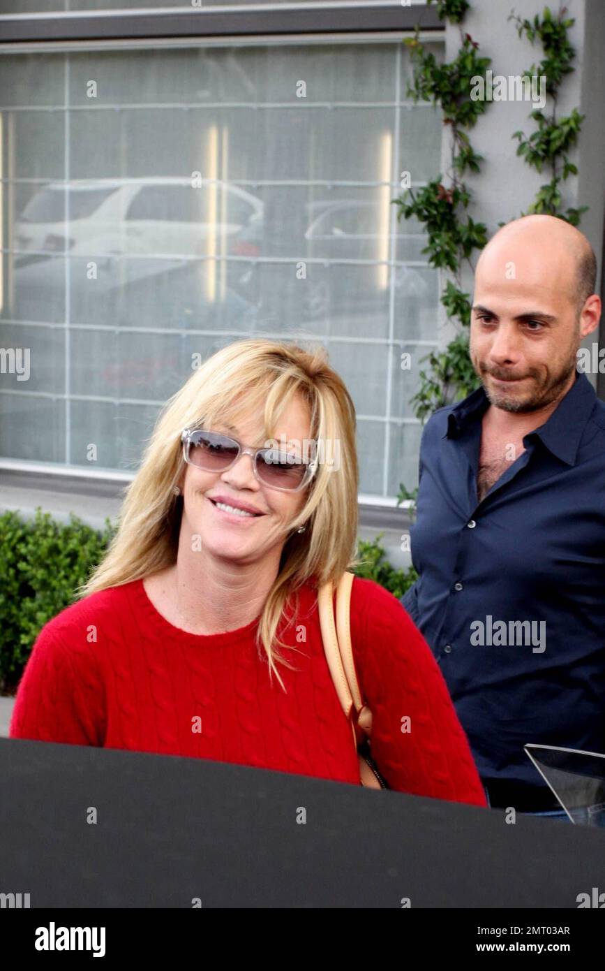 Actress Melanie Griffith is all smiles as she leaves the Neil George Salon in Beverly Hills, CA ...