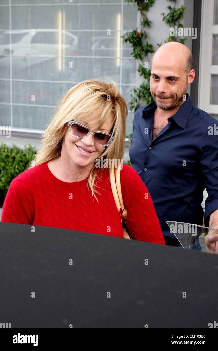 Actress Melanie Griffith is all smiles as she leaves the Neil George Salon in Beverly Hills, CA ...
