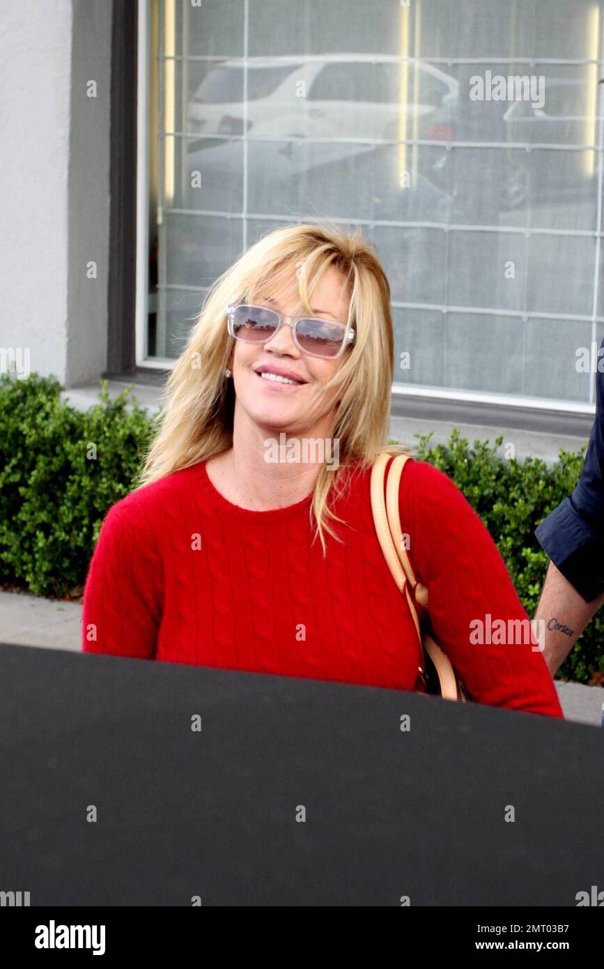Actress Melanie Griffith is all smiles as she leaves the Neil George ...