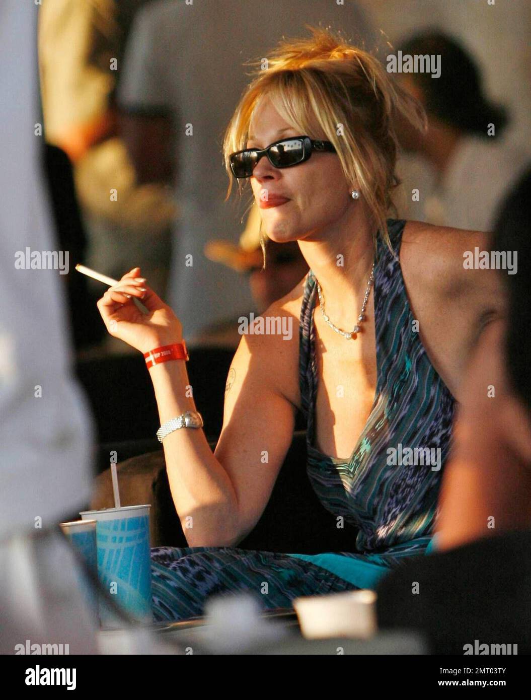 Melanie Griffith takes a smoke break whilst enjoying the Coachella ...