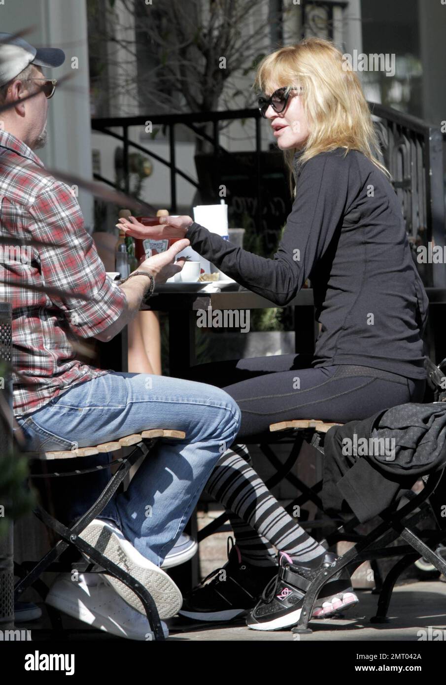 EXCLUSIVE!! Wearing an all black outfit, accessorized with funky ...