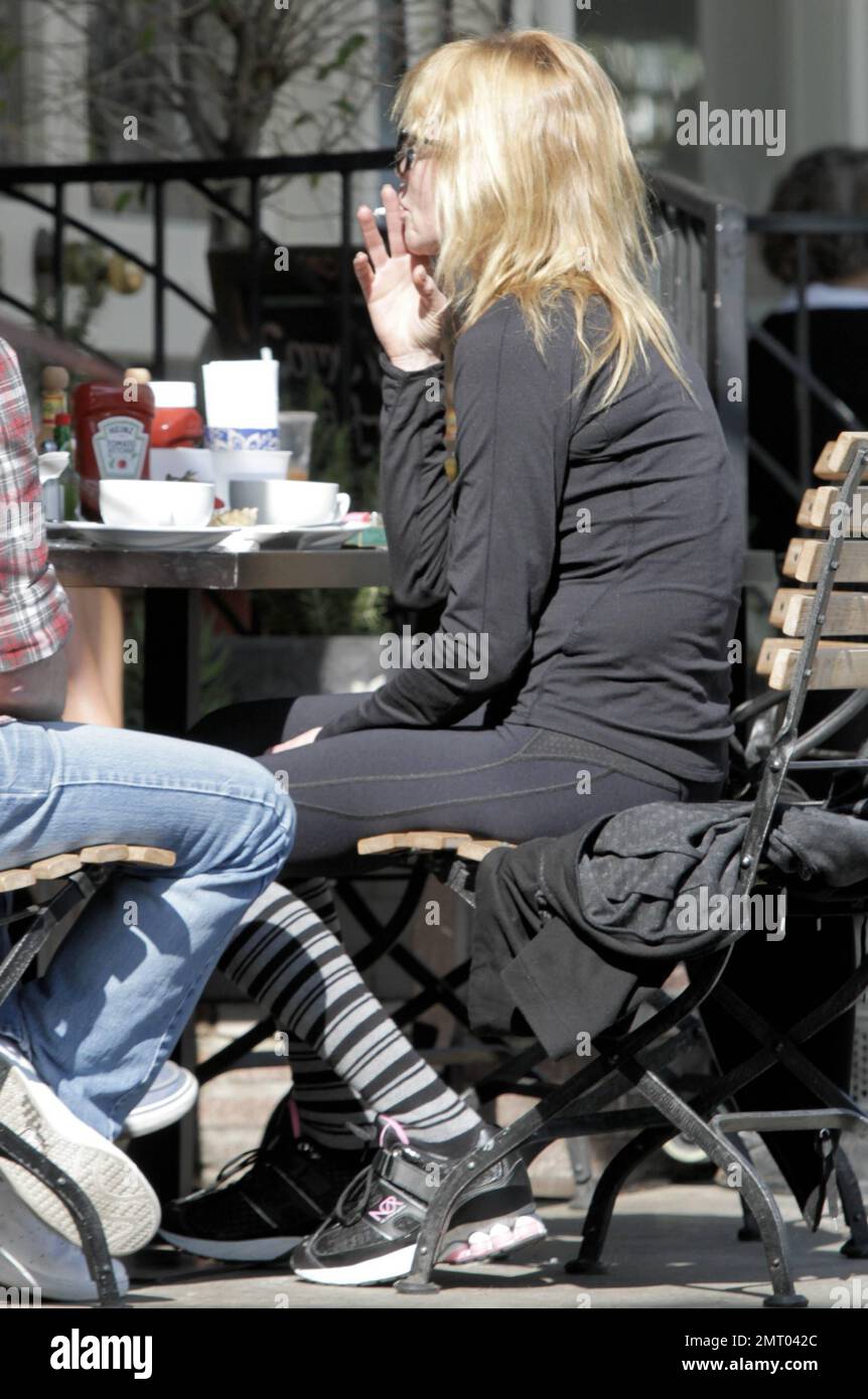 EXCLUSIVE!! Wearing an all black outfit, accessorized with funky ...