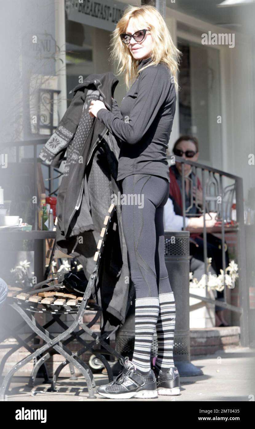 EXCLUSIVE!! Wearing an all black outfit, accessorized with funky ...