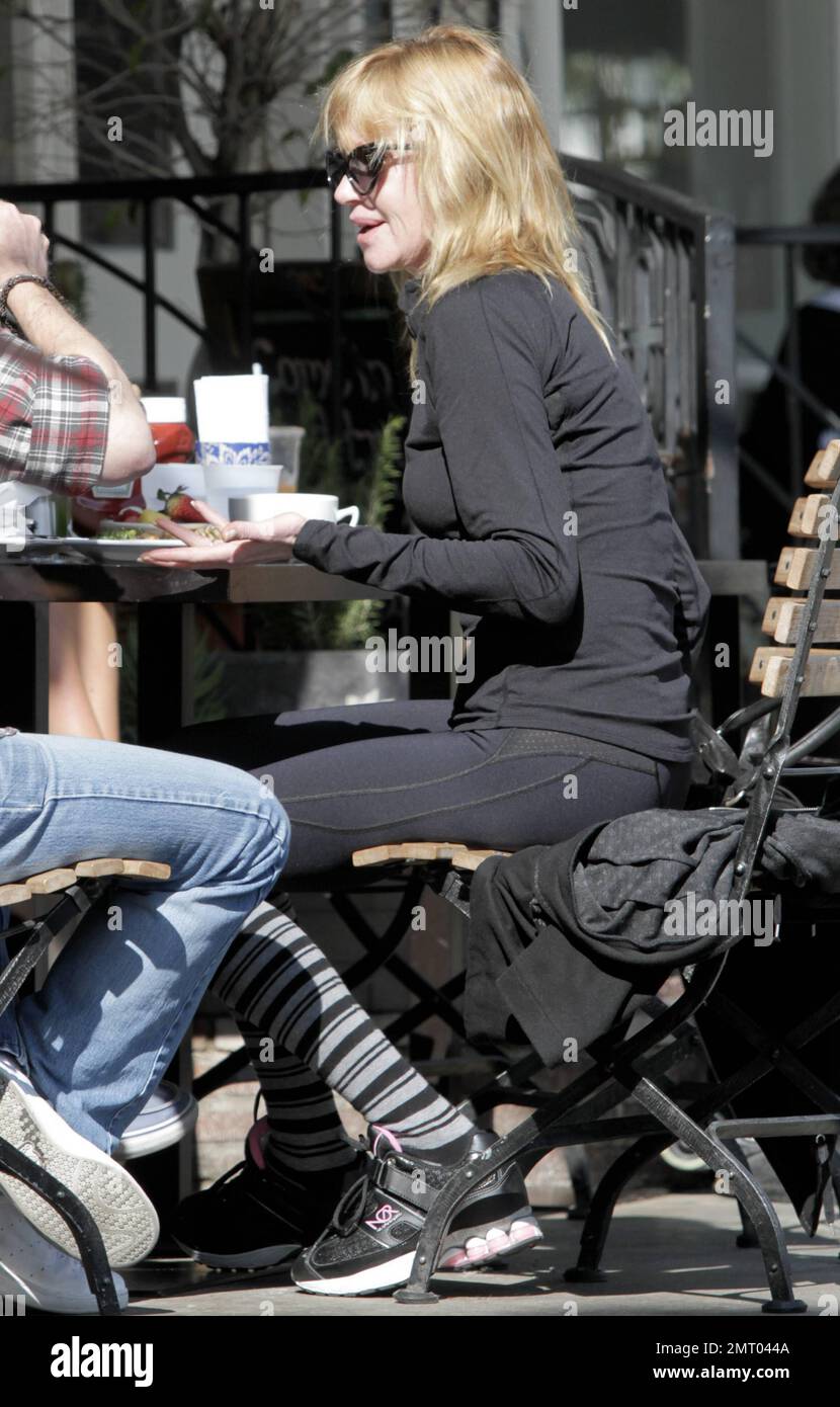 EXCLUSIVE!! Wearing an all black outfit, accessorized with funky ...