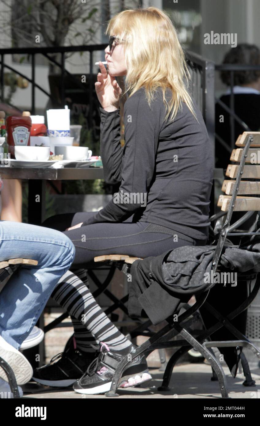 EXCLUSIVE!! Wearing an all black outfit, accessorized with funky ...