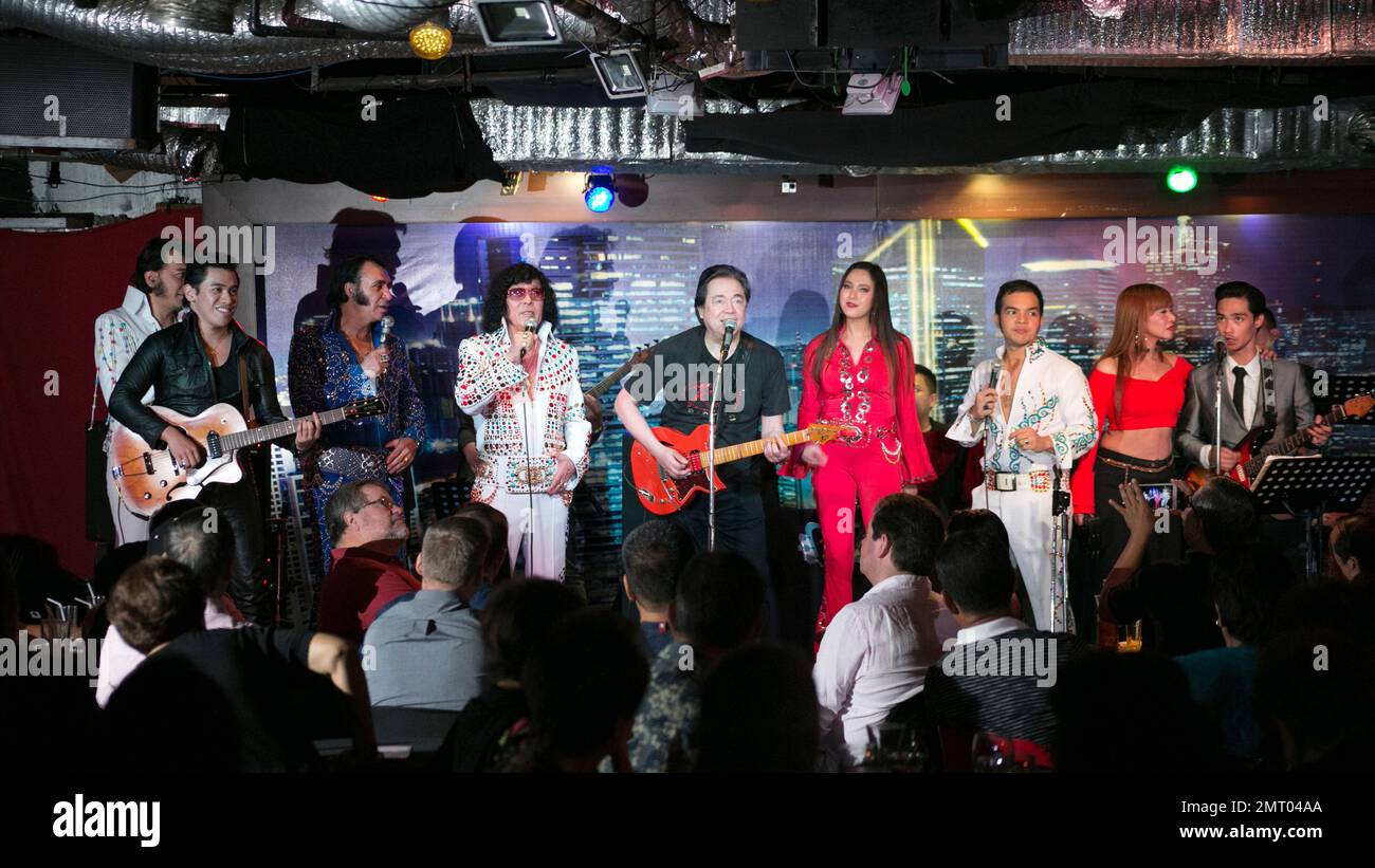 In this Aug. 10, 2017, photo, Elvis impersonators perform on stage in ...