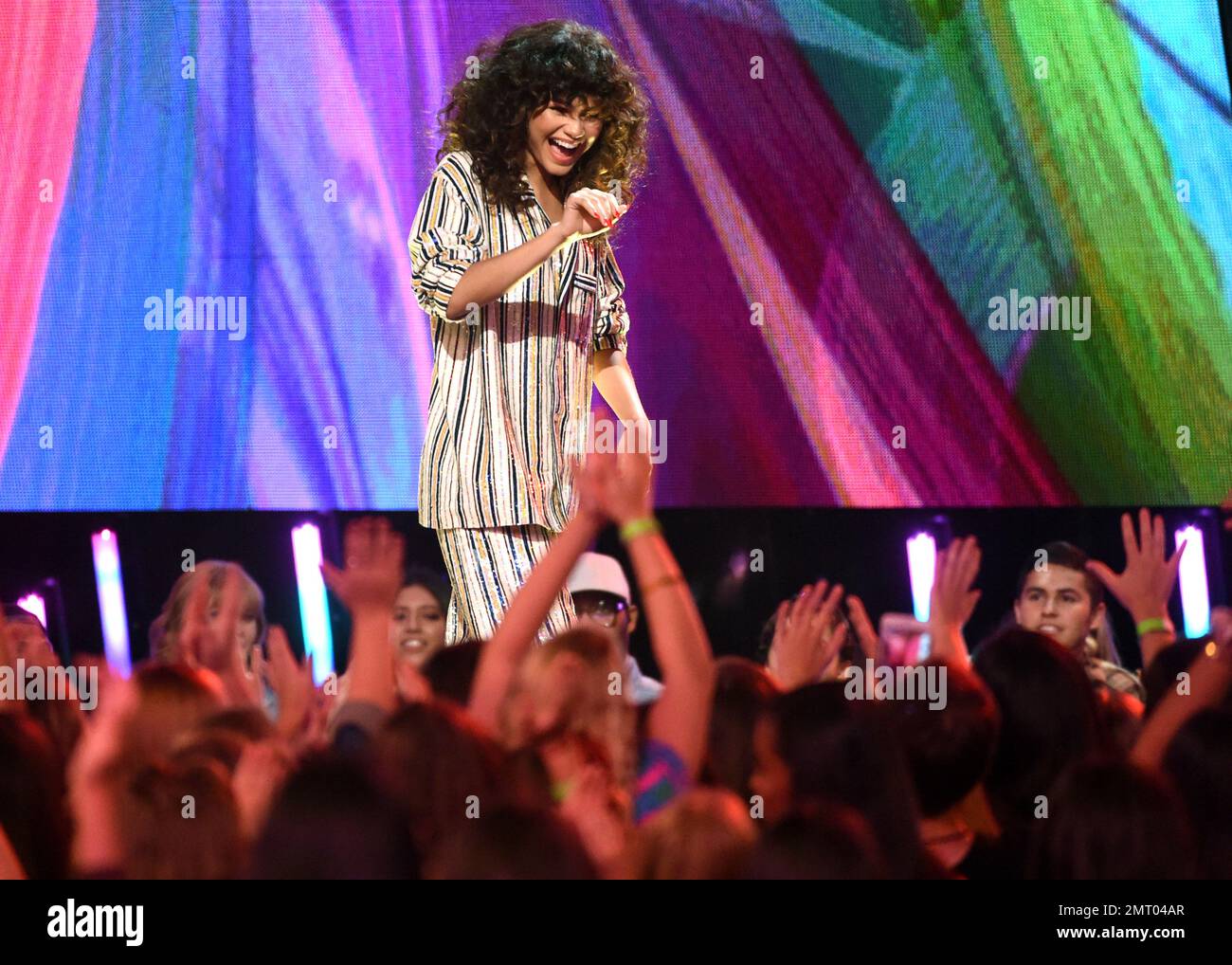 Zendaya walks on stage to accept the award for choice summer movie ...