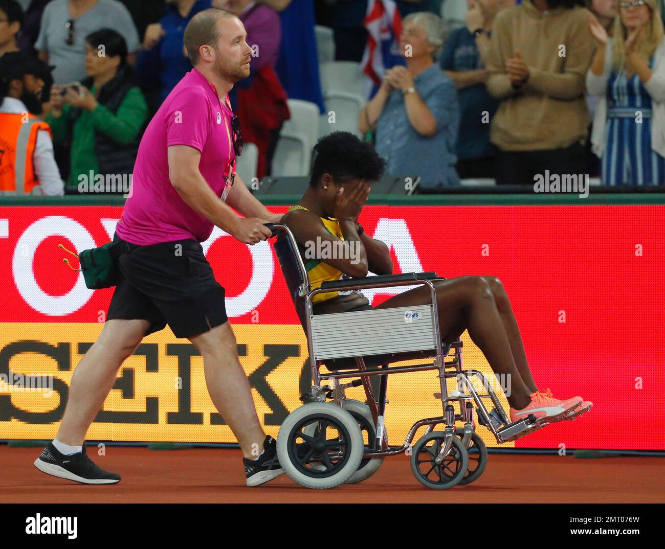 Jamaica's Anneisha McLaughlin-Whilby sits in a wheelchair after ...