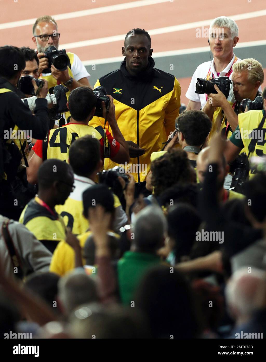 Jamaica's Usain Bolt is greeted by spectators during his lap of honor ...