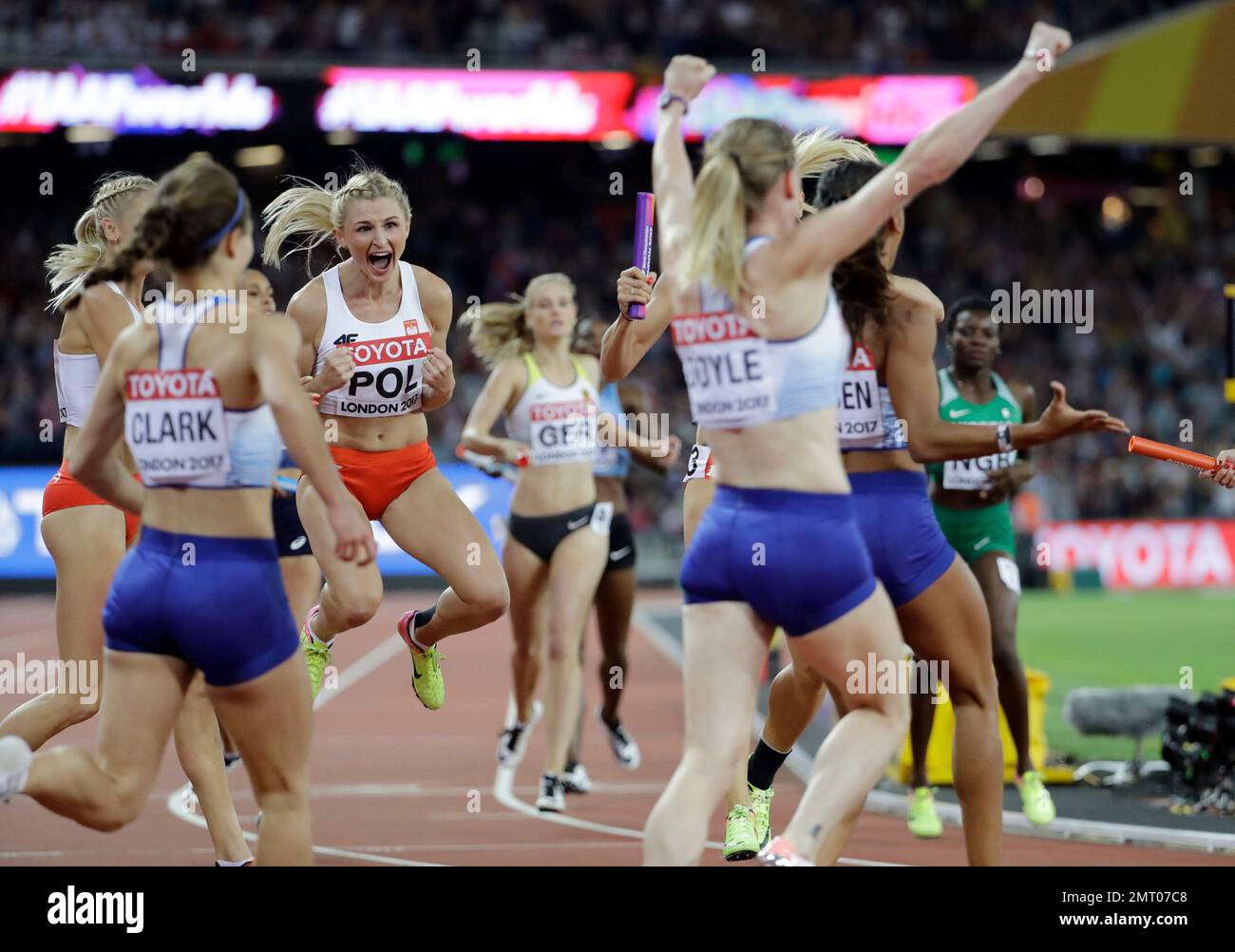 Britain's and Poland's, center, teams celebrate after winning the ...