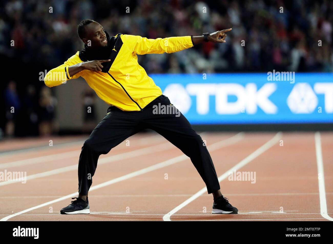 Jamaica's Usain Bolt performs his trademark pose during a victory lap ...