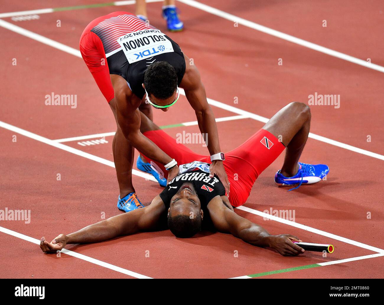 Trinidad and Tobago's Lalonde Gordon is embraced by teammate Jarrin ...