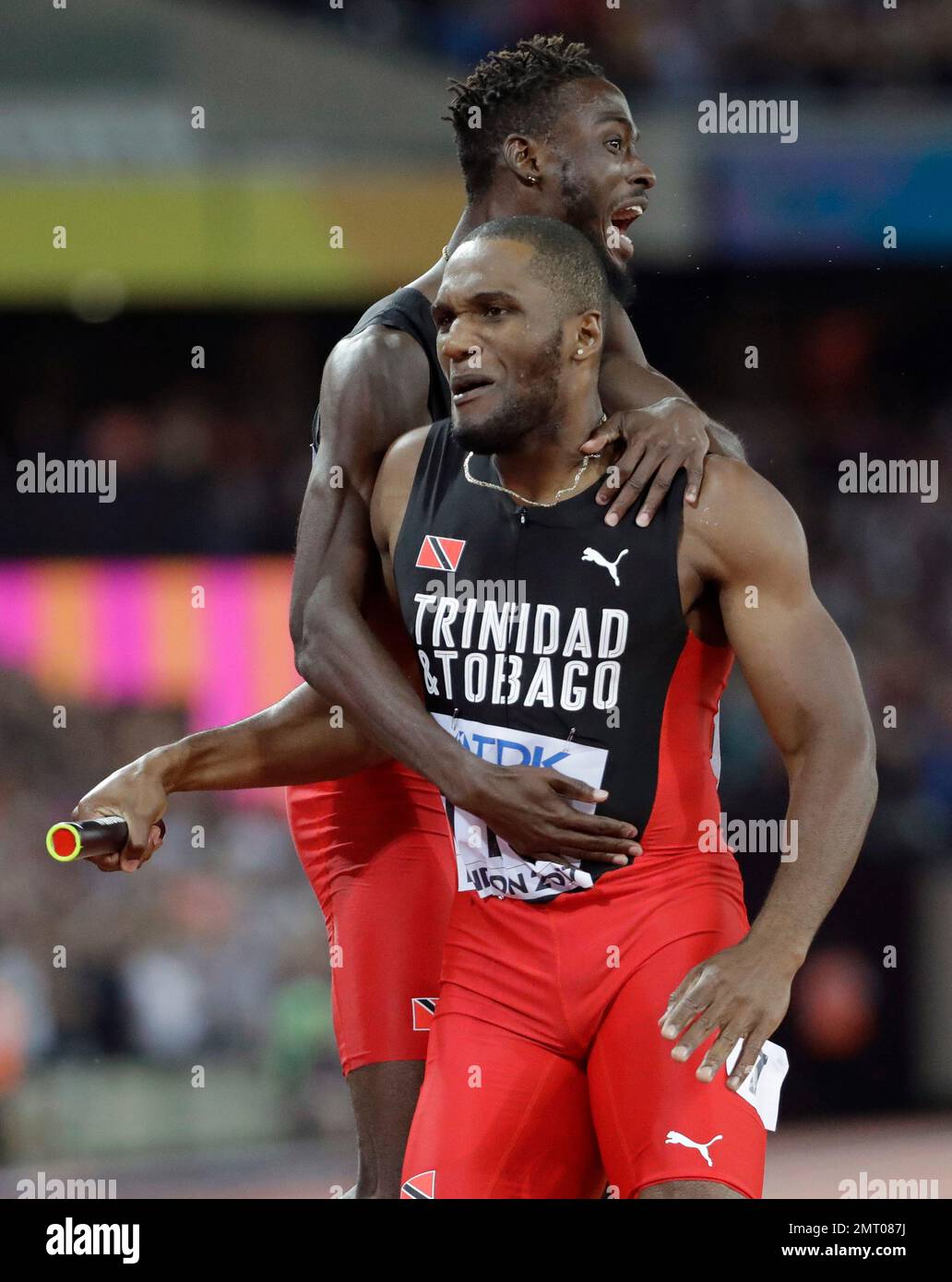 Trinidad and Tobago's Lalonde Gordon, front, celebrates after running ...