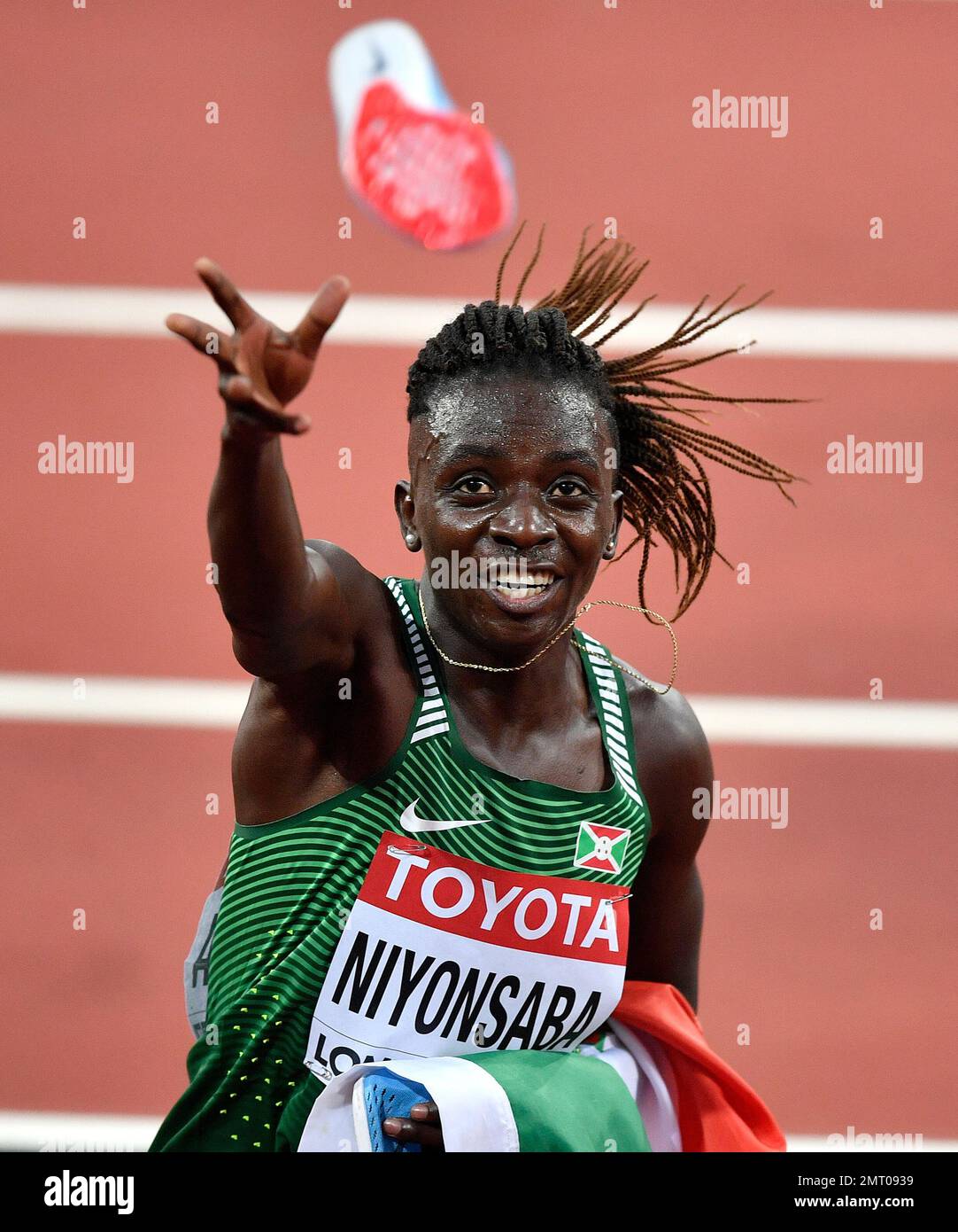 Burundi's Francine Niyonsaba throws her shoe into the crowd after ...