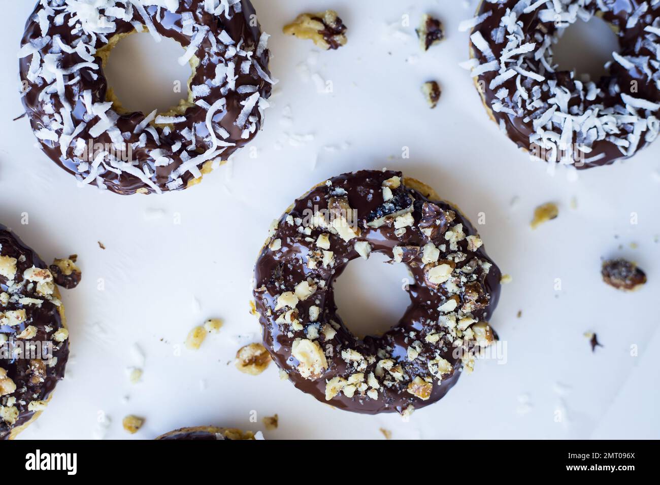 A delicious donuts loaded with toppings on white background Stock Photo ...