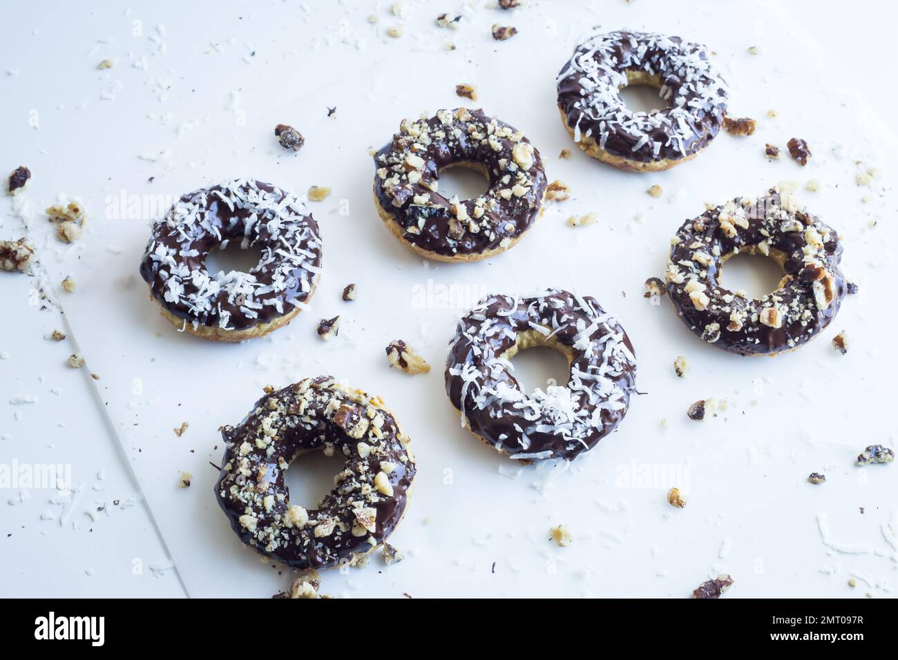 A delicious donuts loaded with toppings on white background Stock Photo ...