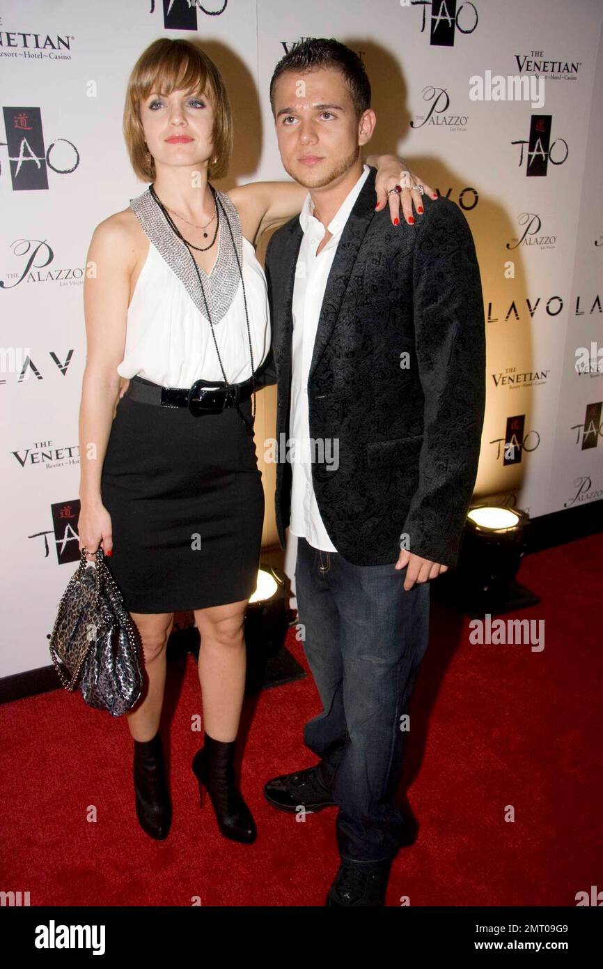 Actress Mena Suvari poses on the red carpet with music producer fiance Simone Sestito to ...