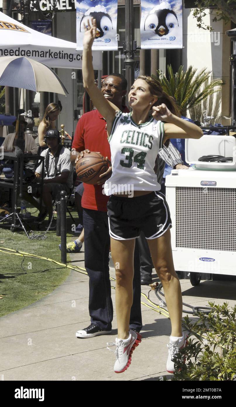 Maria Menounos practices her basketball moves with Paul Pierce during ...
