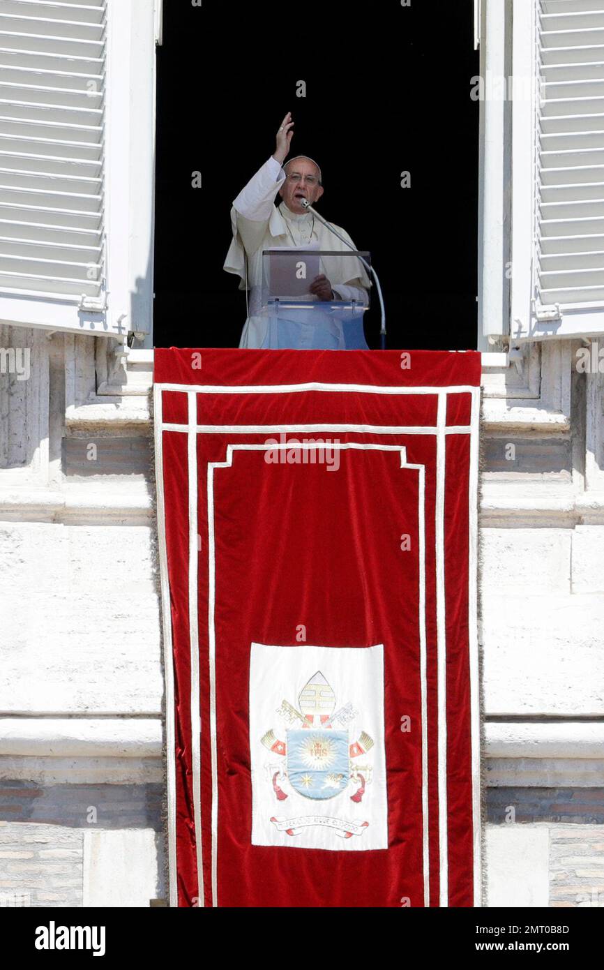 Pope Francis delivers his blessing from his studio's window overlooking ...