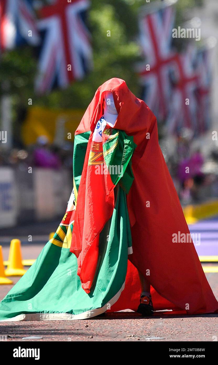 Portugal's Ines Henriques is covered in a Portuguese flag as she ...
