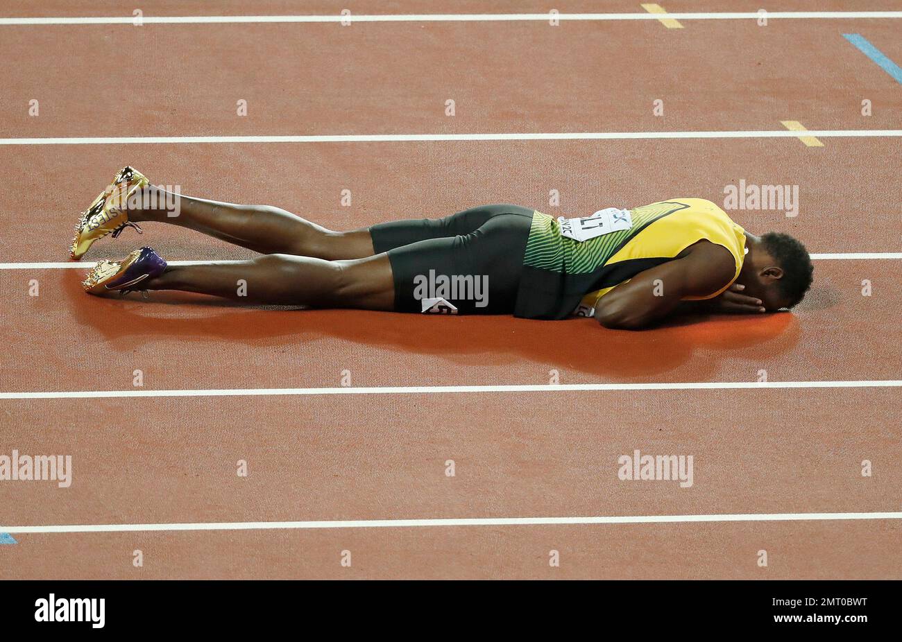 Jamaica's Usain Bolt falls after suffering an injury in the men's 4x100 ...