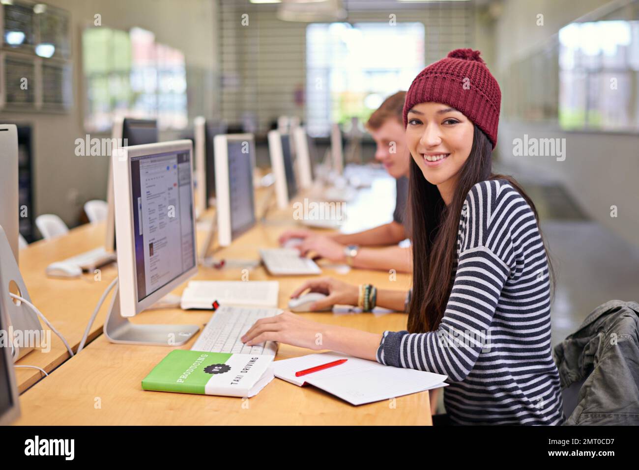 Working towards that A grade. students working on computers in a ...