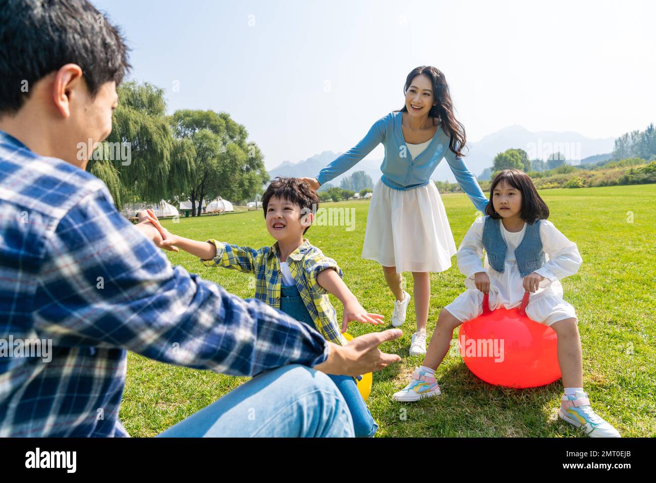 East asian family jumping hi-res stock photography and images - Alamy