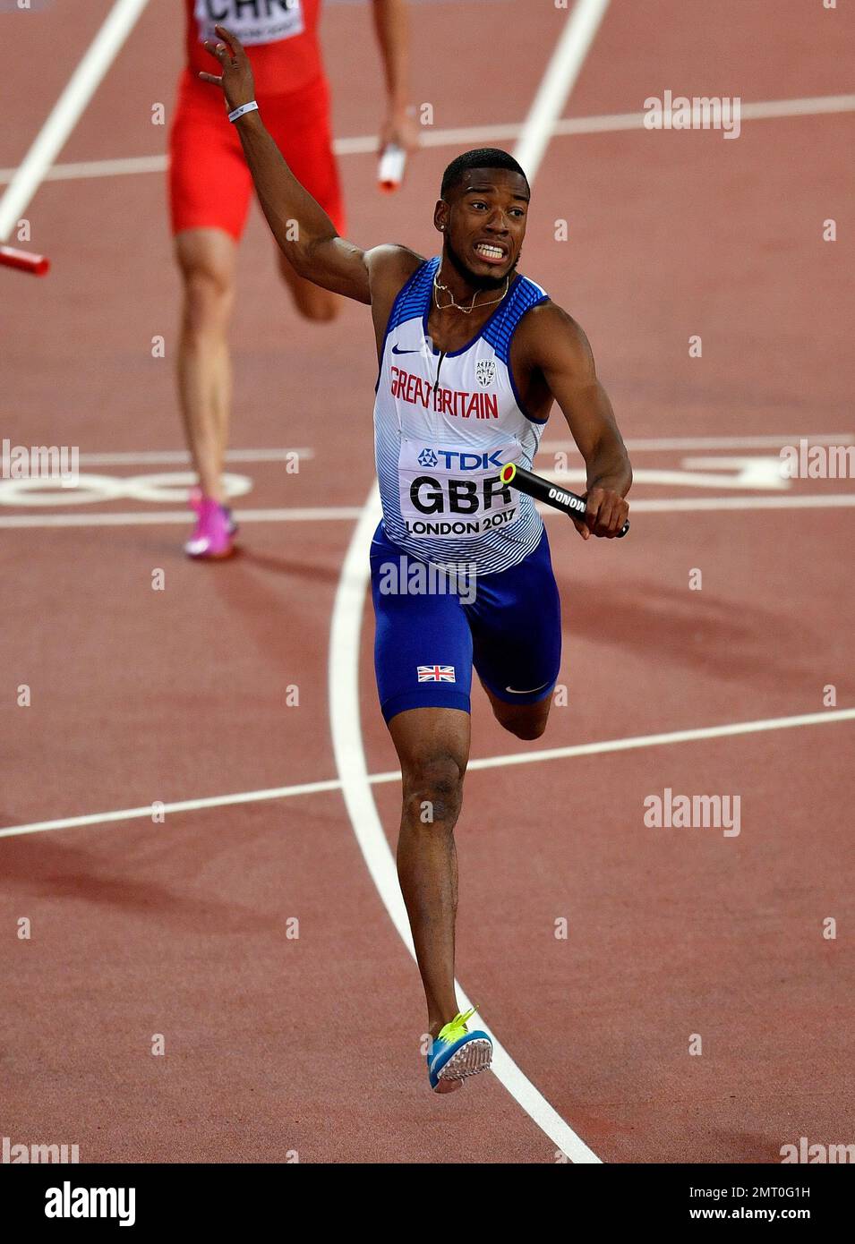 Britain's Nathaniel Mitchell-Blake crosses the fin line to win his team ...