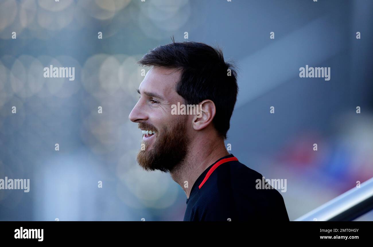 FC Barcelona's Lionel Messi smiles during a training session at the ...